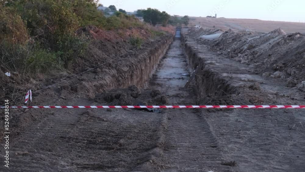 A large trench was dug in the ground. Pipeline laying. Excavation ...