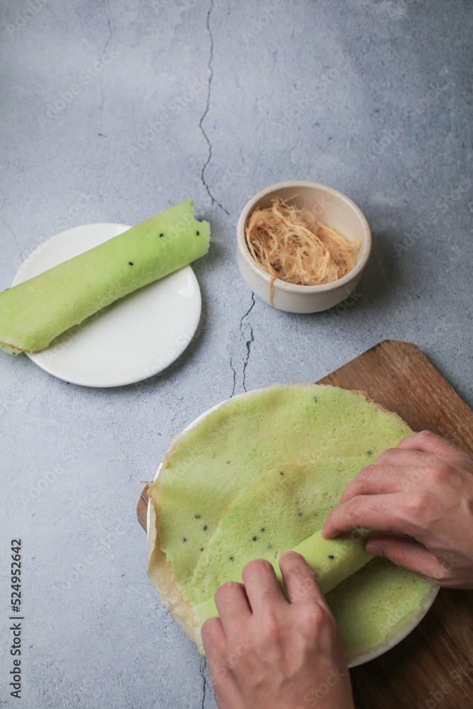 Hand roll Thai cotton candy burrito pancake or Roti Saimai, thin sheet ...