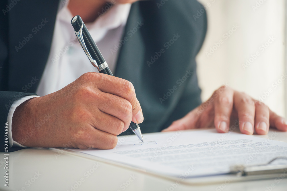 Asian business man using pen signing on new contract to starting ...