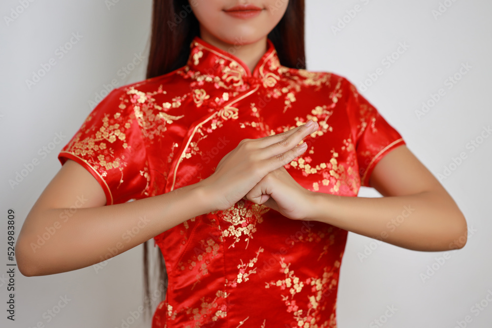 Close up short of young Asian woman hands in red Chinese dress ...