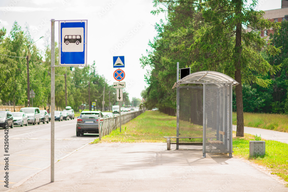 Public empty bus stop with city timetable. Stock Photo | Adobe Stock