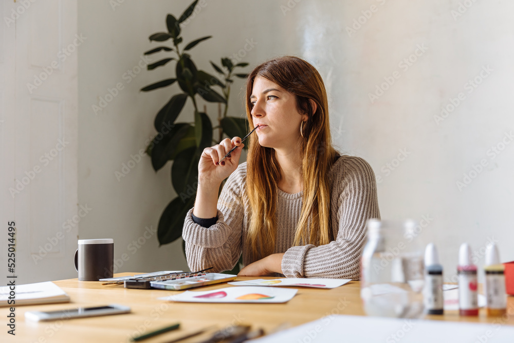 Artist thinking while drawing Stock Photo | Adobe Stock