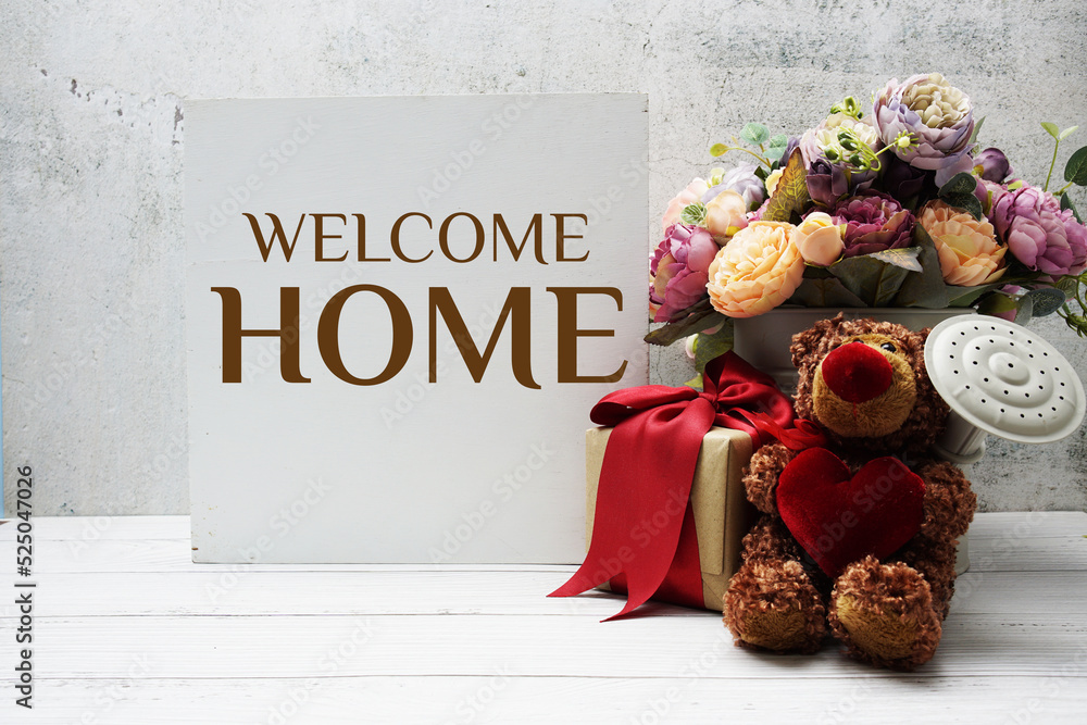 Welcome Home text message with teddy bear and gift boxes present Stock ...