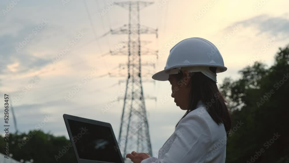 Vídeo do Stock: Asian female electrical engineer working on laptop near ...