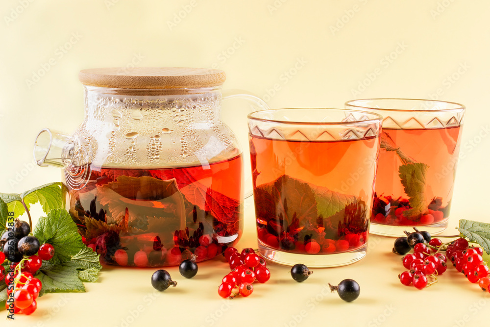 Tea made from berries and leaves of black and red currants in a ...