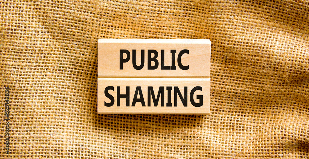 Public shaming symbol. Concept words Public shaming on wooden blocks on ...
