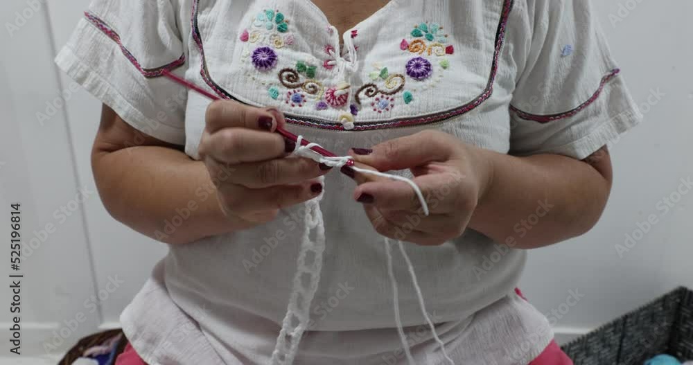 Female adult hands starting to knit a simple square pattern, making a ...