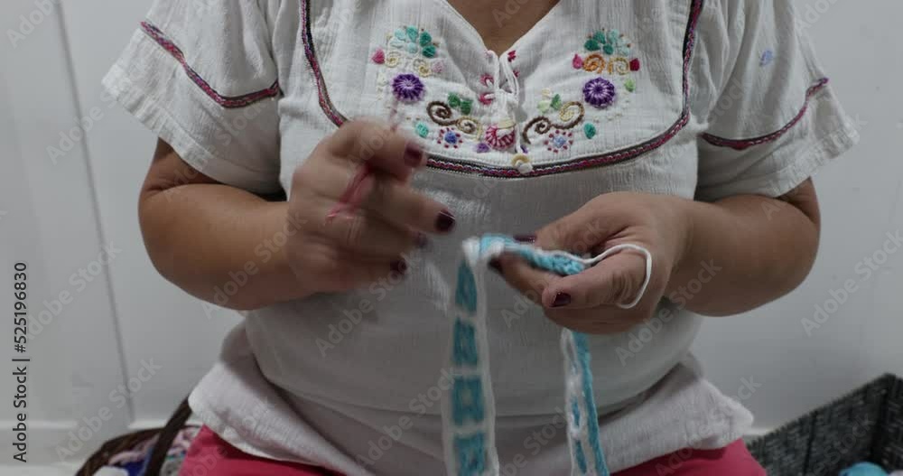Female adult hands starting to knit and making a mistake and undoing ...