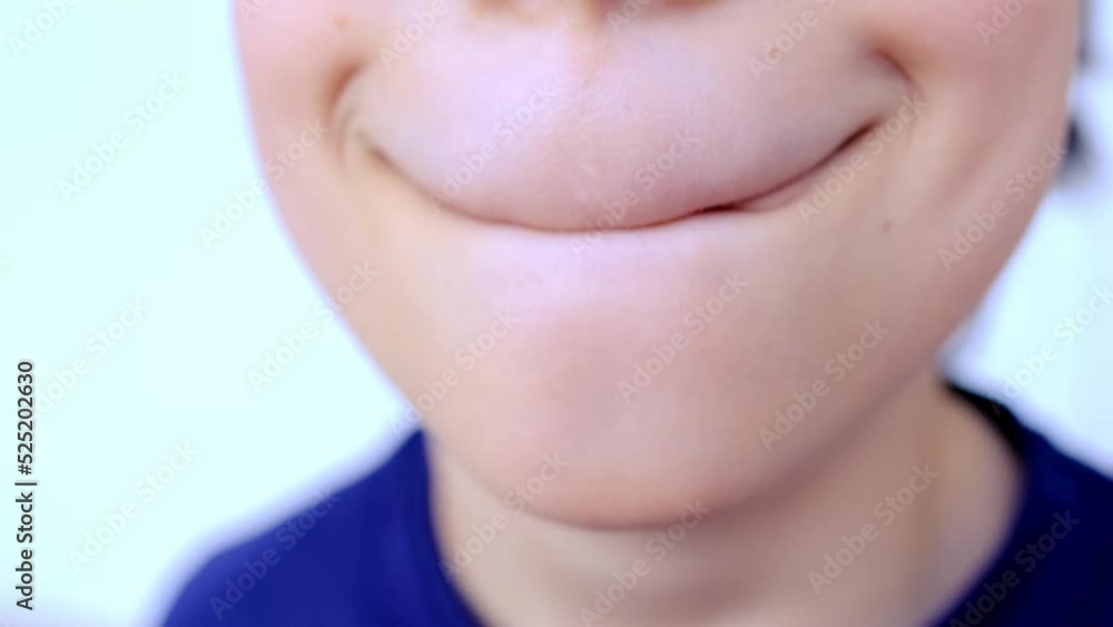 close-up and front view of mouth of caucasian child, boy of 10 years ...