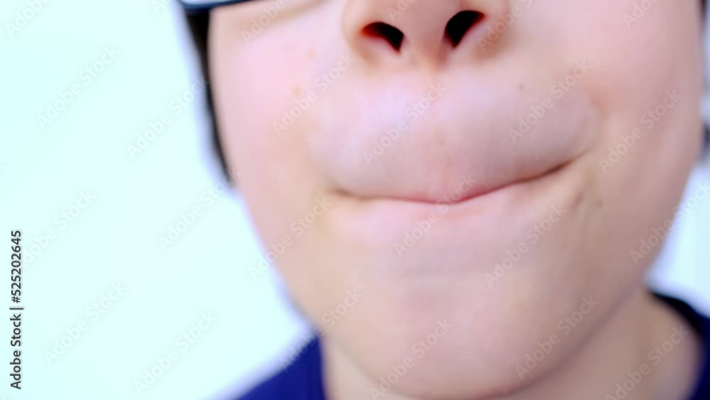 close-up and front view of mouth of caucasian child, boy of 10 years ...