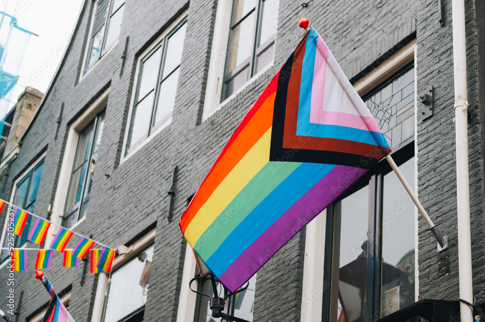 Modern progress LGBTQ pride flag during pride month. Includes people of ...