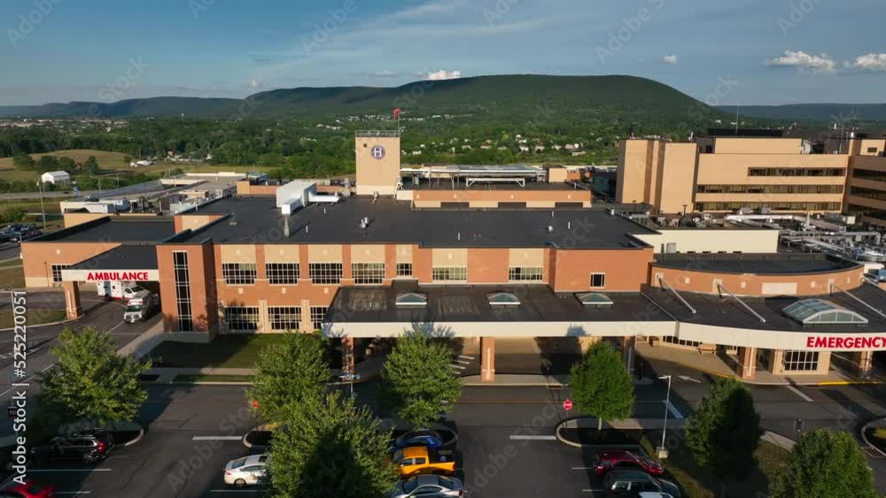 Hospital aerial establishing shot. Signs for Emergency, Ambulance ...