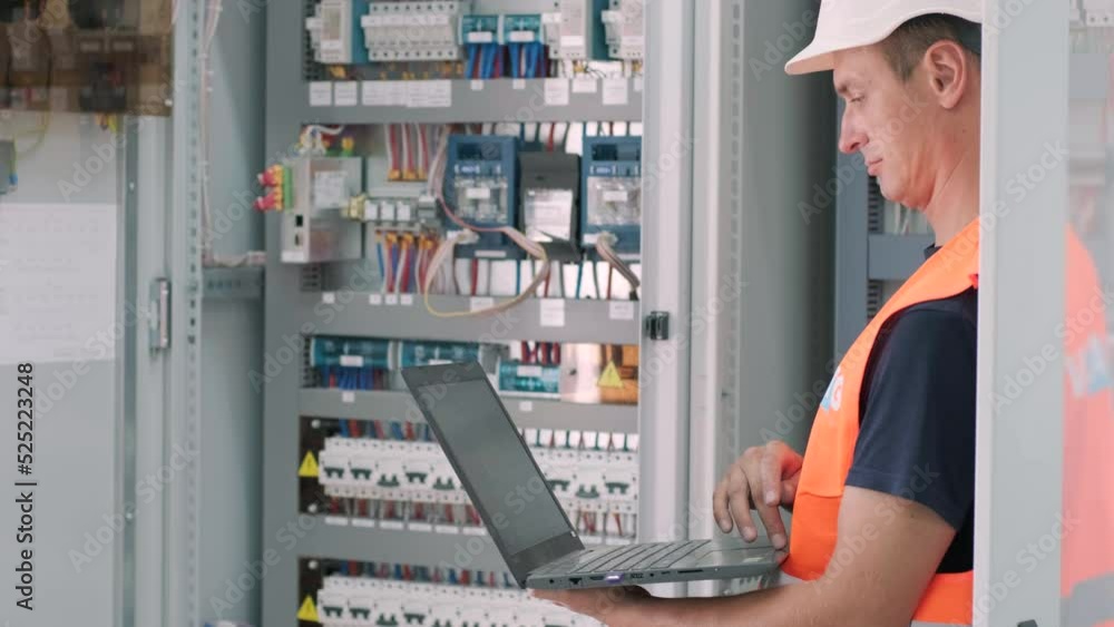 Electrical engineer working check the electric current voltage and ...