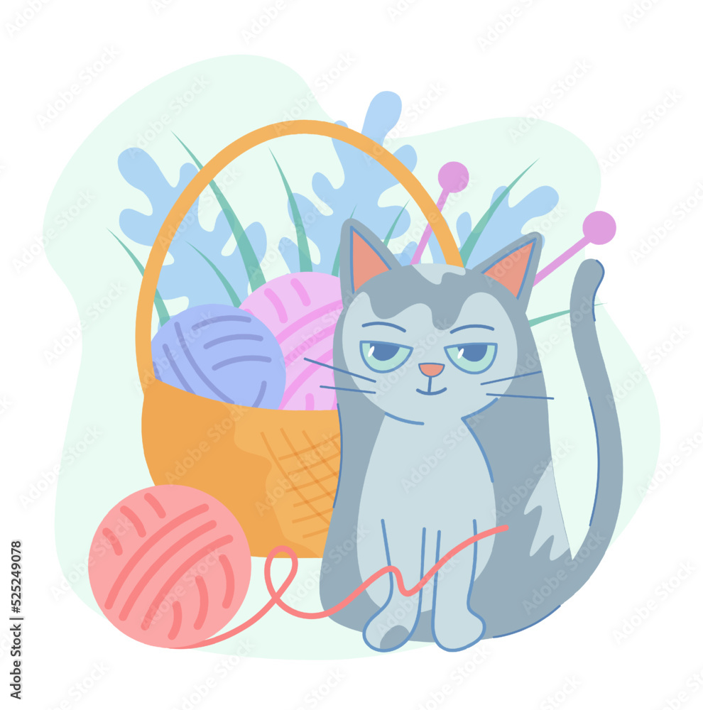 The cat sits at a knitting basket with multi-colored skeins of woolen ...