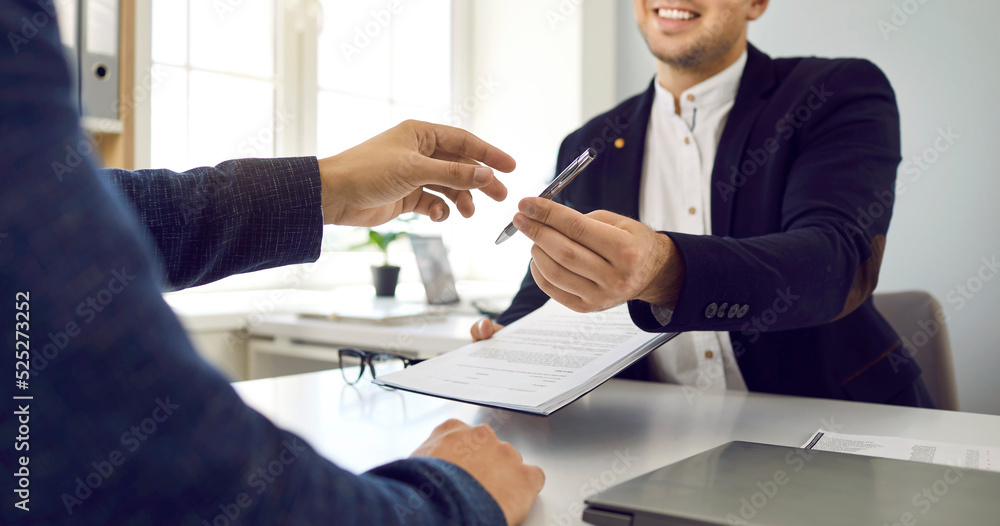 Two young people meet in the office, make a deal and sign a contract ...