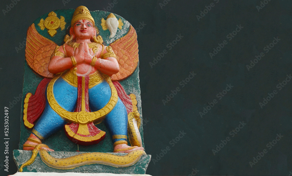 Garuda is a divine bird, servants of Vishnu. Religious sculpture on the ...