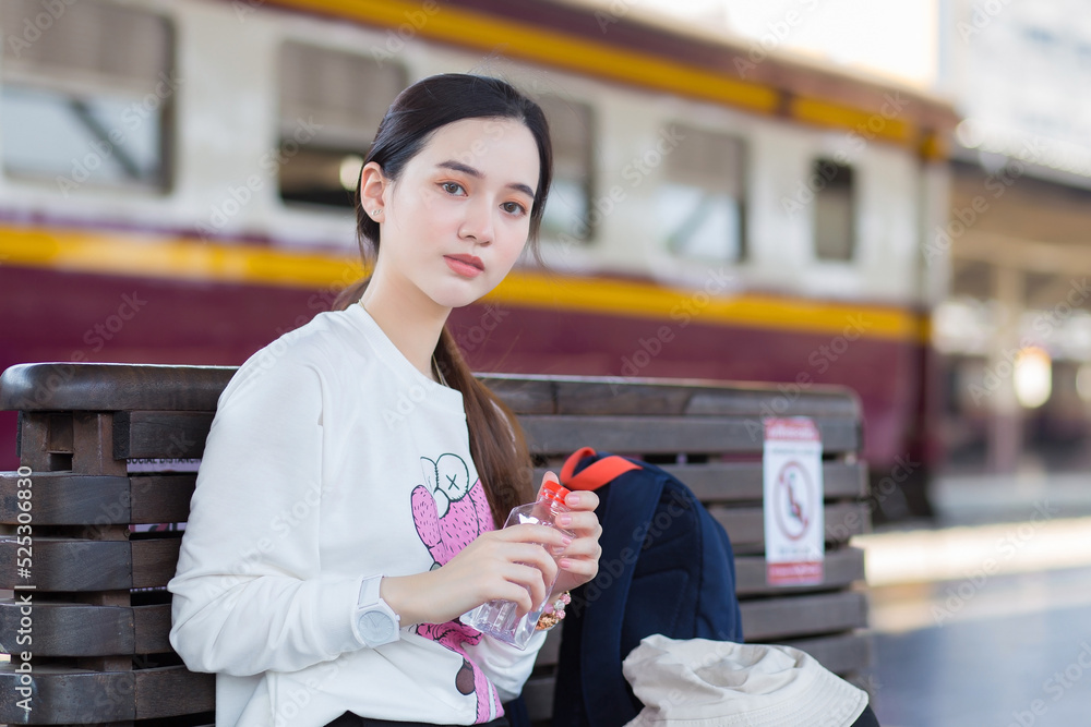 Asian Woman Who Wears White Long Sleeve Sits On Chair And Feels Tried