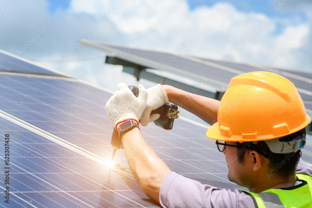 Asian male worker Work with solar panels and install solar panels at ...