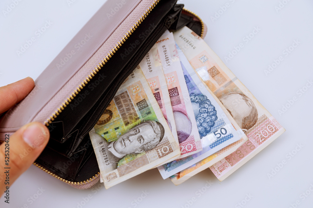 Croatian kunas in a wallet of different denominations on a white ...