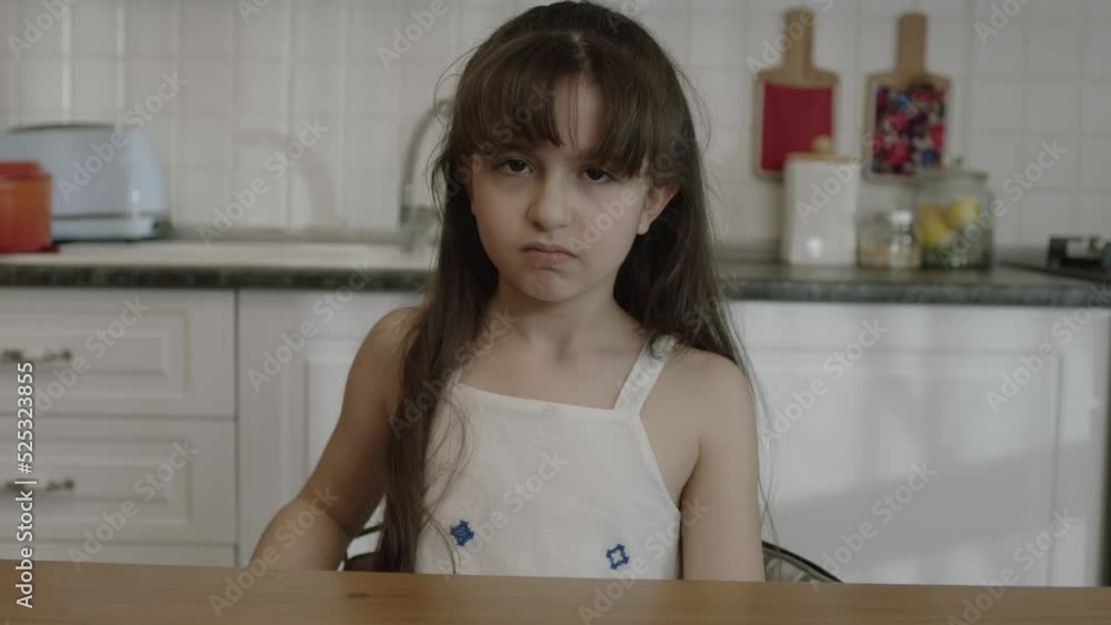 Little girl angry, angry and disobedient at bad behavior showing middle ...