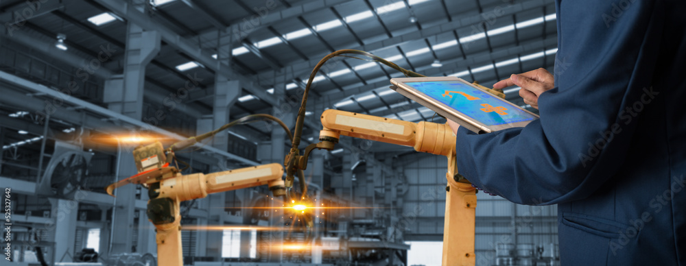 Manager or Industrial engineer working and control robotic with ...