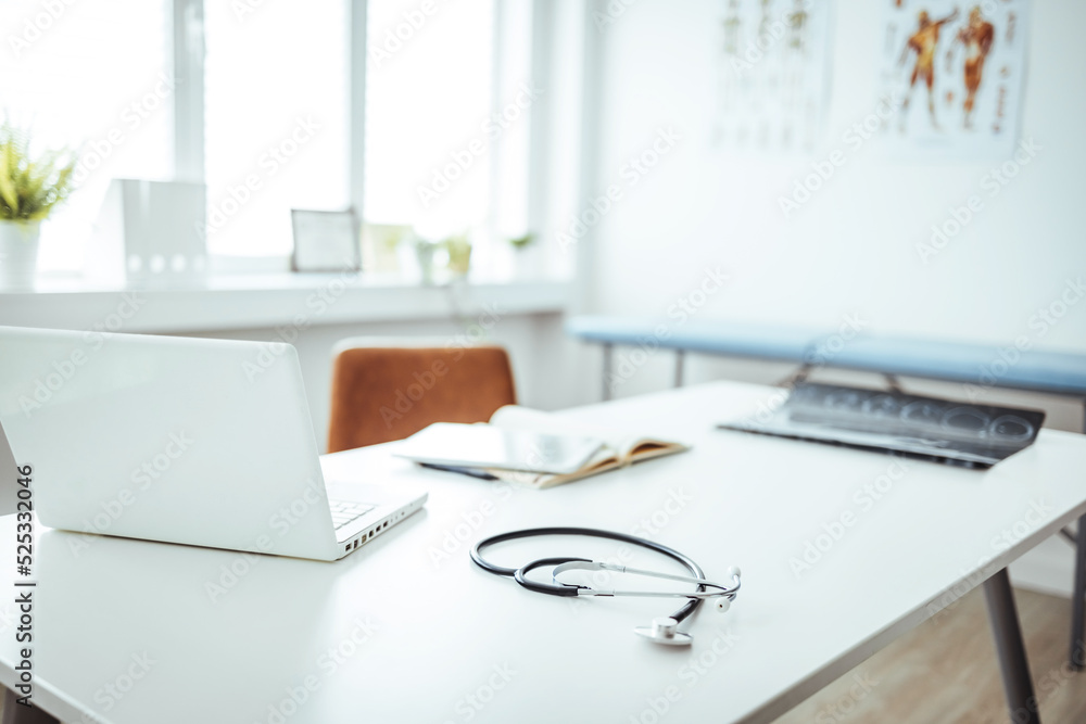 Empty Doctor's Office With Examination Table And Doctor's Desk ...