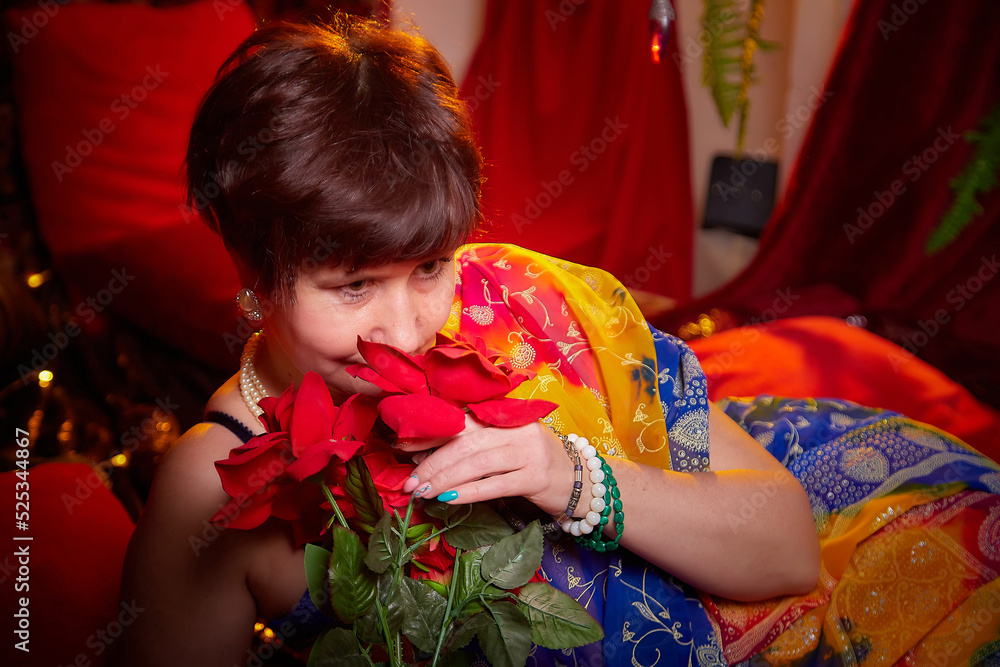 A beautiful European girl with short hair looking like an Arab woman in ...