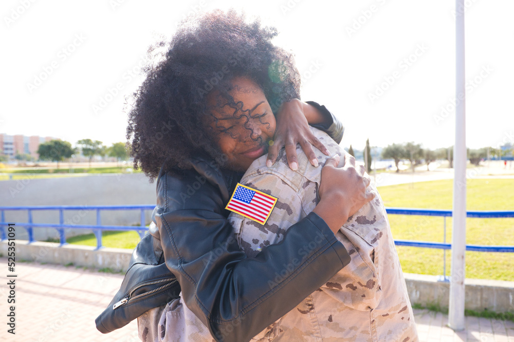 Afro-American woman and American soldier who has just arrived from the ...