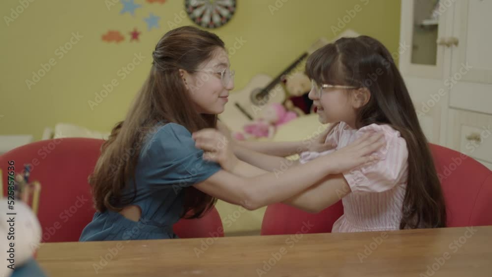 Two little girls are fighting each other in their room. Girls who ...