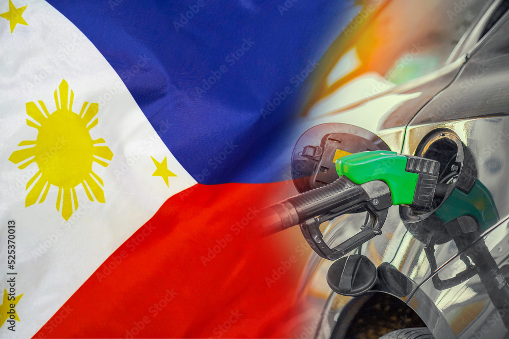 Car with a fuel injector on Philippines flag background. Record prices ...