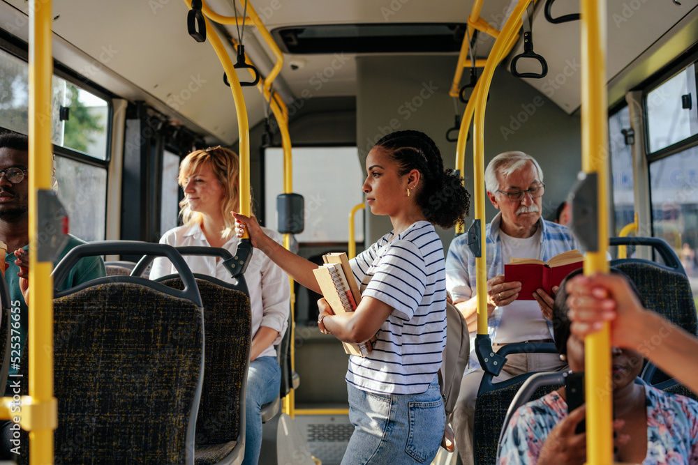 Student on way to university in public bus Stock Photo | Adobe Stock