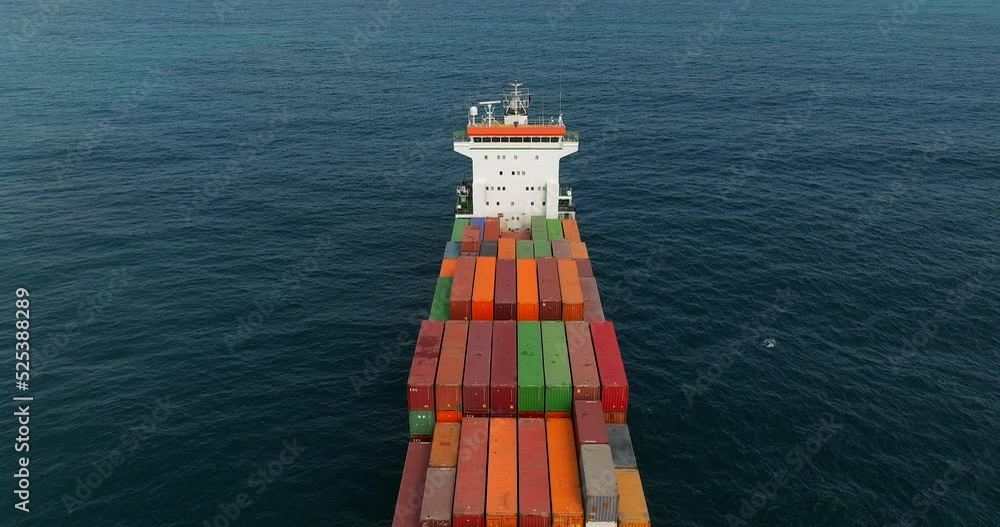 Container ship loaded with Shipping containers holding position at sea ...