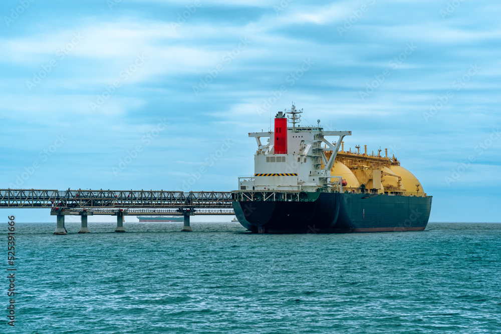 liquefied natural gas tanker vessel during loading at an LNG offshore ...