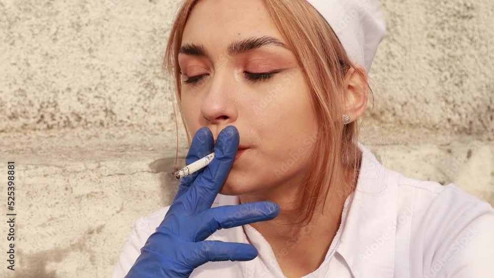 Dirty tired exhausted nurse ash on face sitting hospital infirmary ...