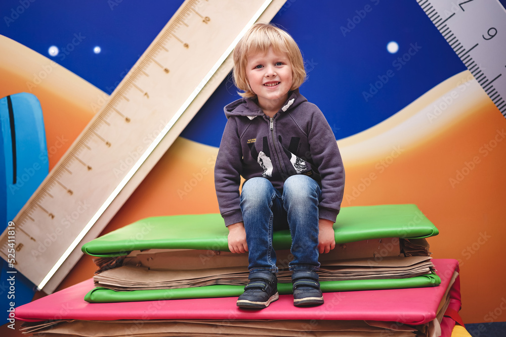 Cute boy on the colorful, bright, school background with various school ...