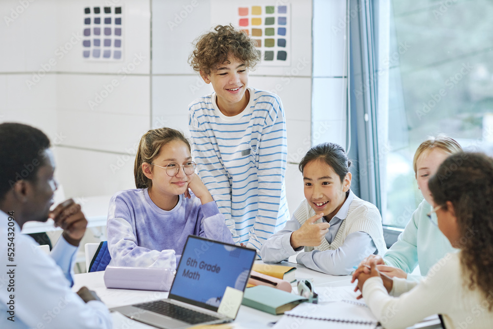 Diverse children smiling happily while enjoying group activity in math ...