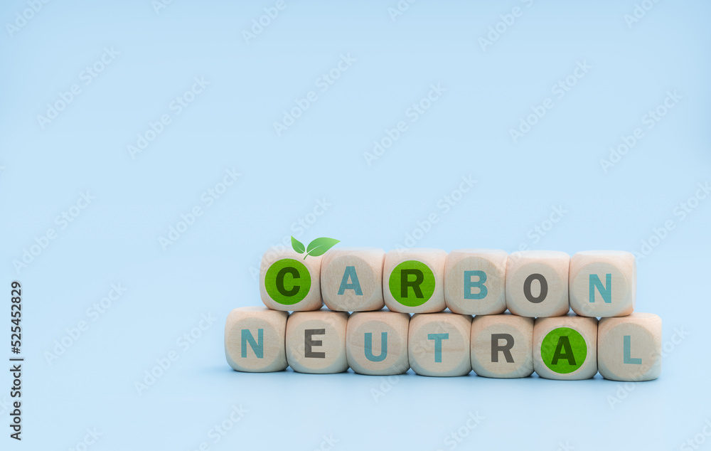 Carbon neutral concept. Wooden cubes with carbon neutral words on blue ...