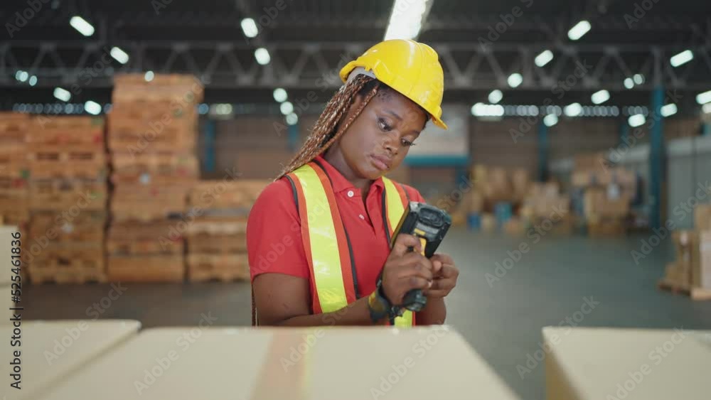 Young African American black woman worker checking stock condition and ...