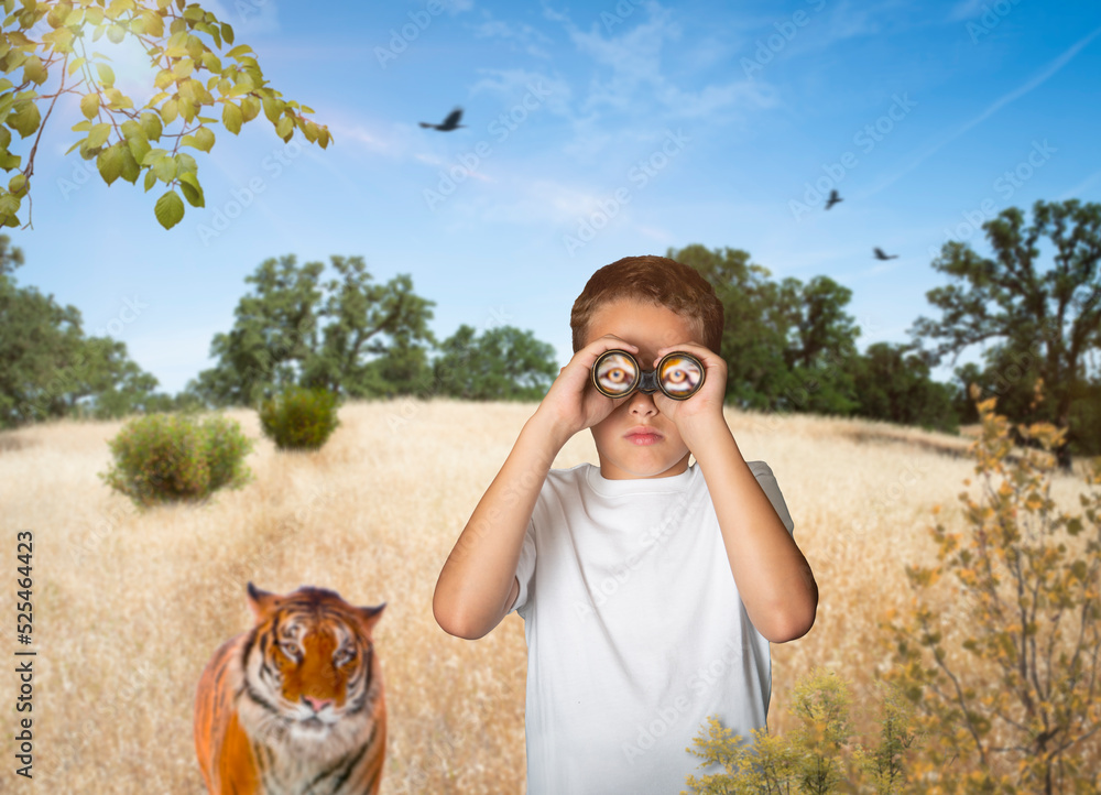 Wild animal watching young explorer boy on summer safari looking ...