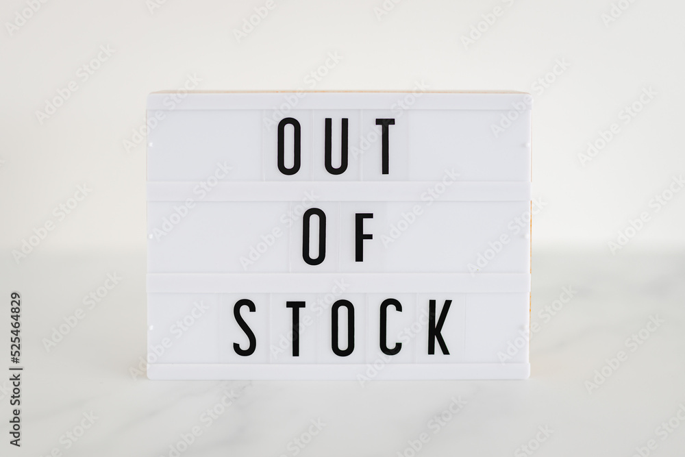 Out of stock text on lightbox on minimalistic white marble background ...