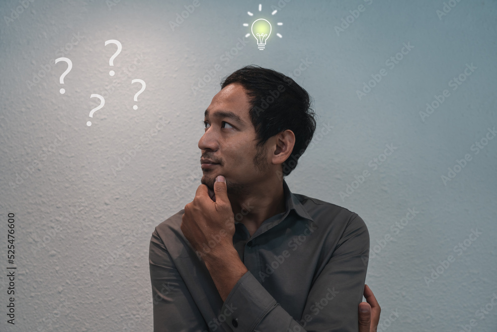 Thinking innovation asian man in looking questions with light idea bulb ...