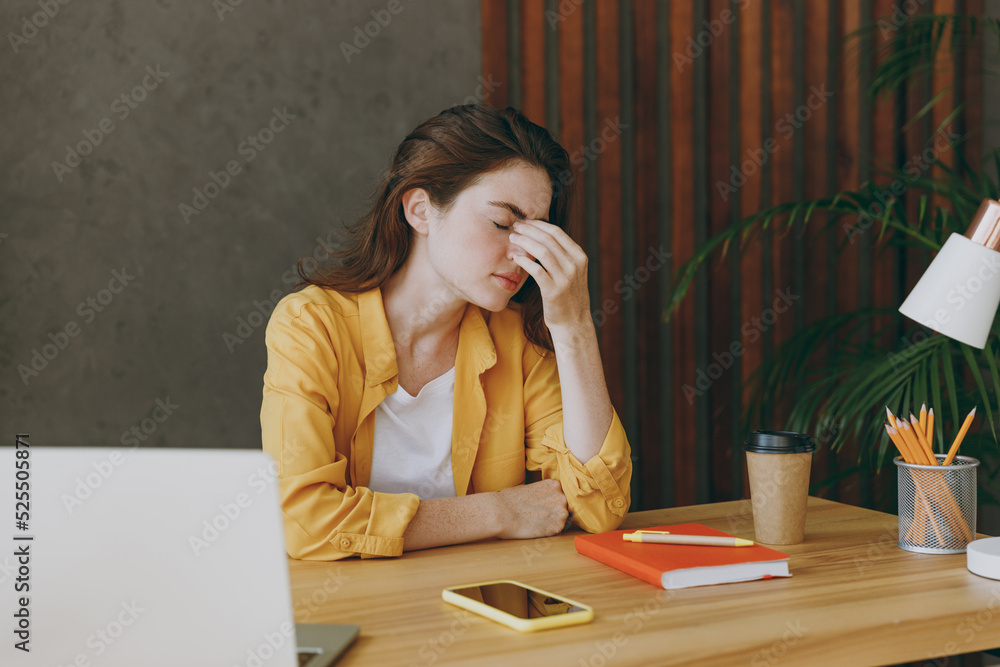 Young tired sad exhausted preoccupied employee business woman wear ...