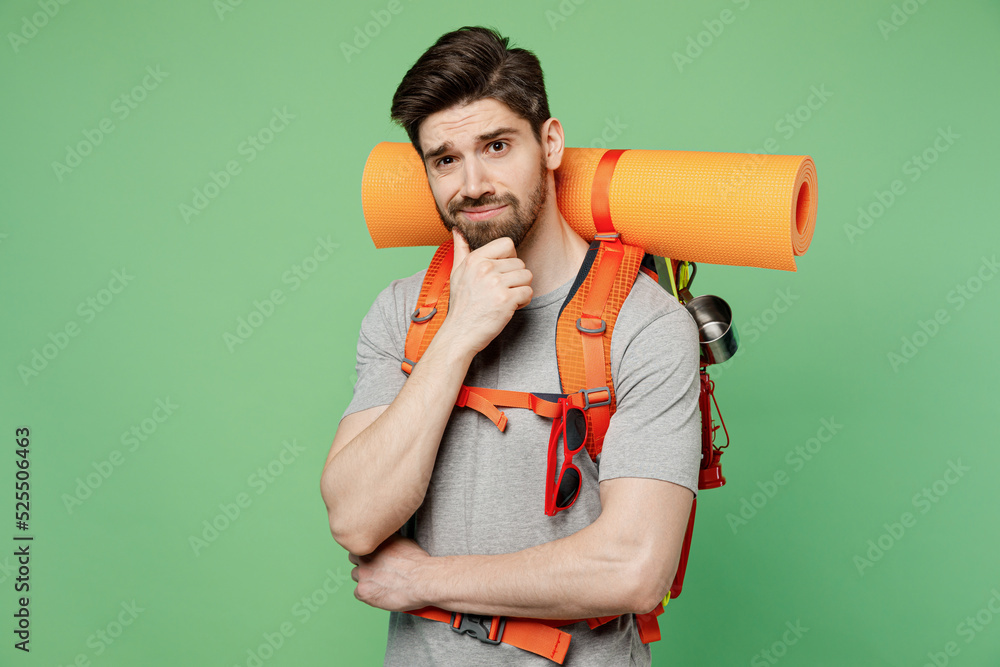 Young minded traveler white man carry backpack stuff mat prop up chin ...