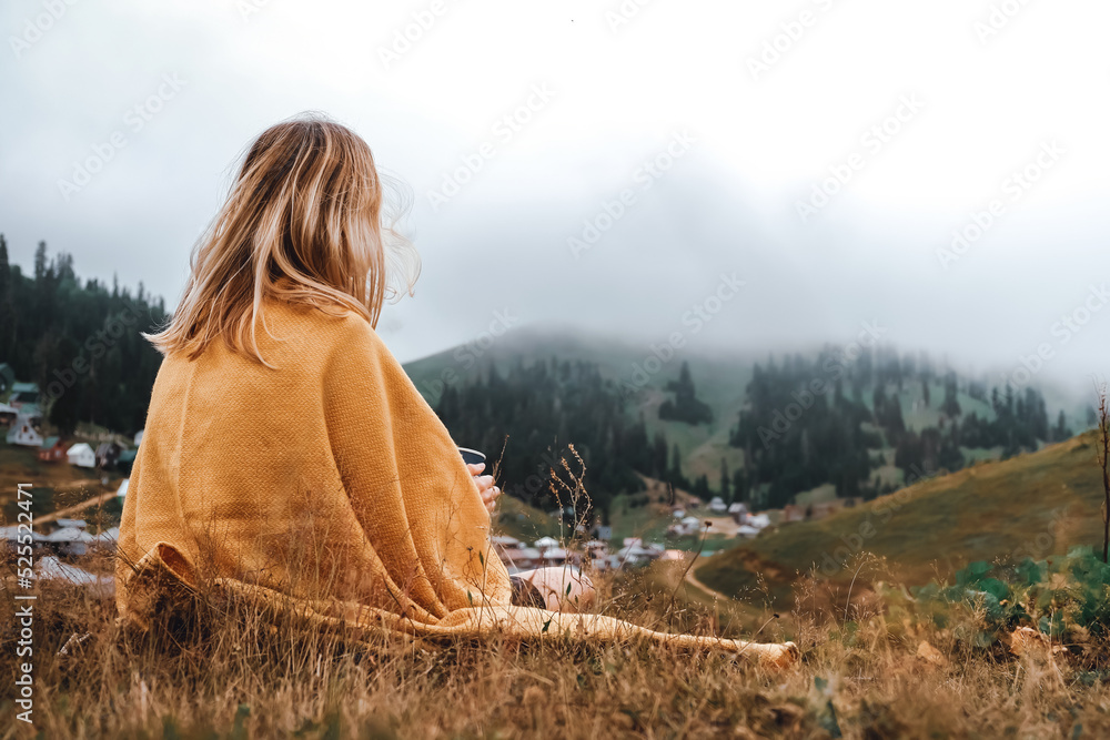 Travel. Girl travels through the mountains and waterfalls of wild ...
