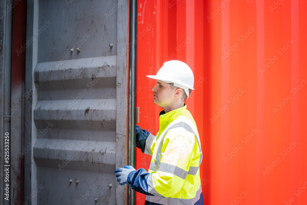 Professional container yard workers checking stock for loading in the ...
