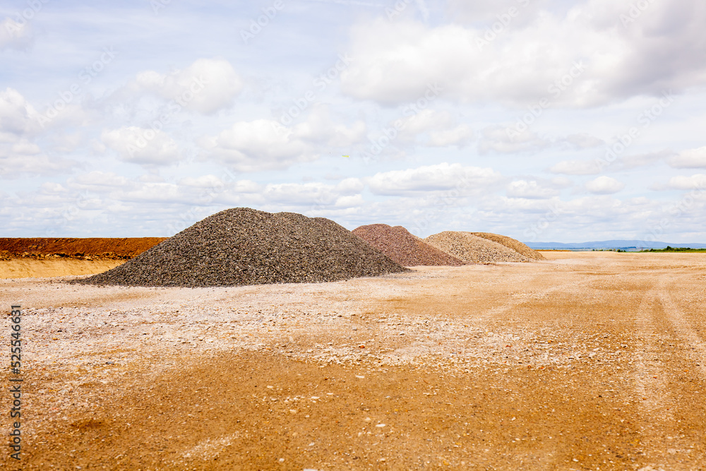 entrance construction site, driveway of building site. Pile of sand and ...