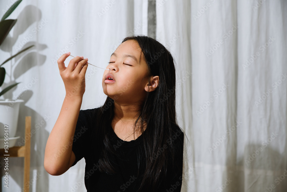 Asian girl preteen girl getting swab test at home, Covid quick rapid ...