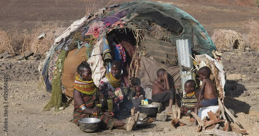 Panning view.Malnourished children due to extreme poverty, drought and ...