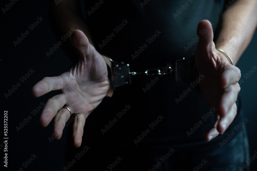 prisoner concept, Handcuffed hands of a prisoner in prison, Male ...