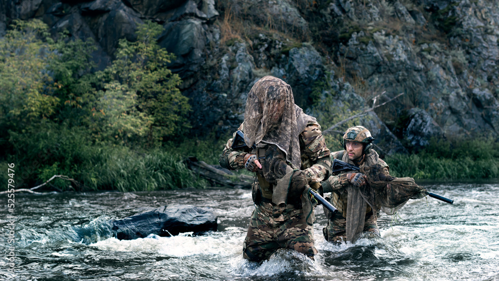 Two mercenary soldiers crossing the river after the completion of the ...
